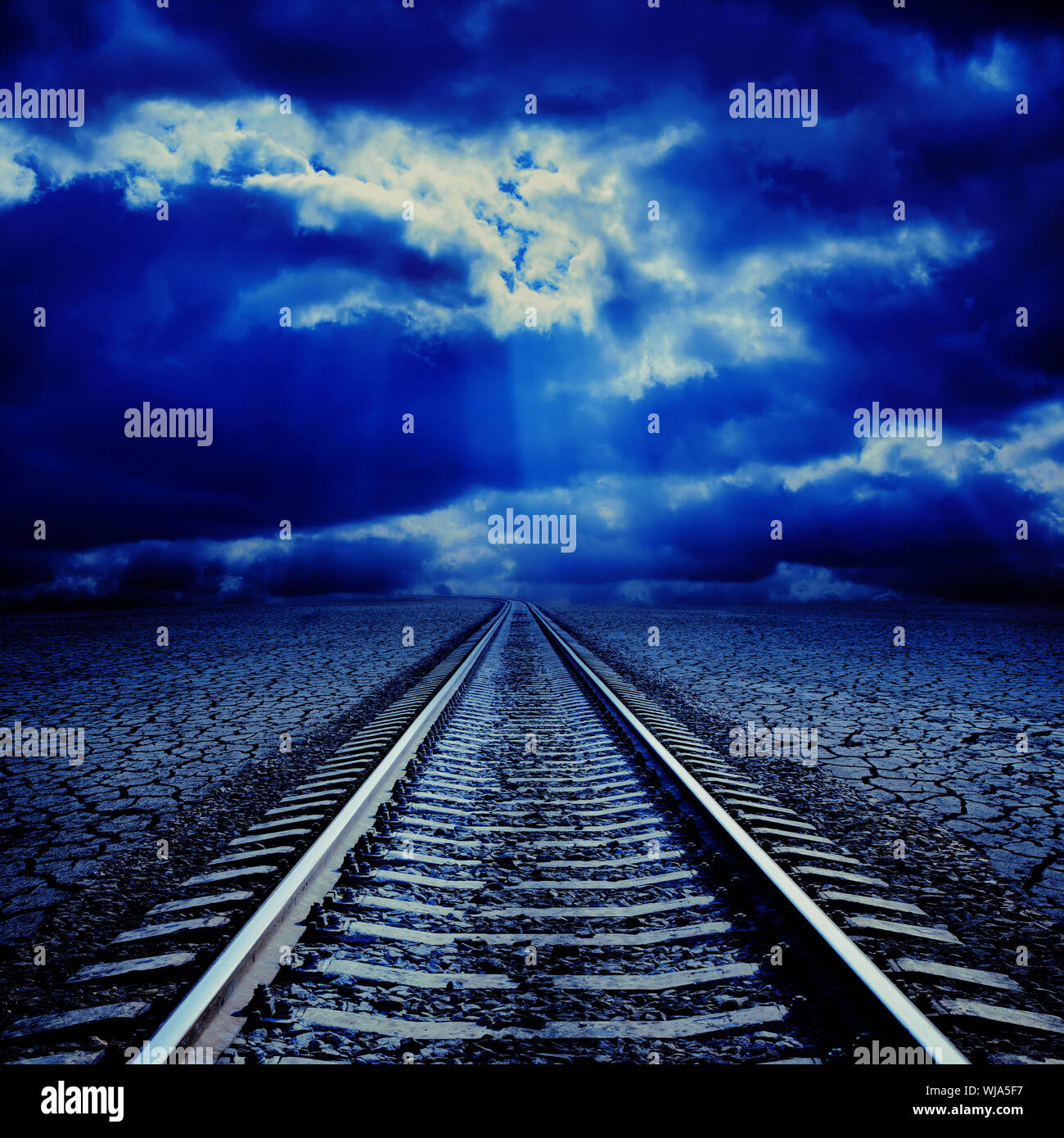 railroad in night to cloudy horizon Stock Photo - Alamy