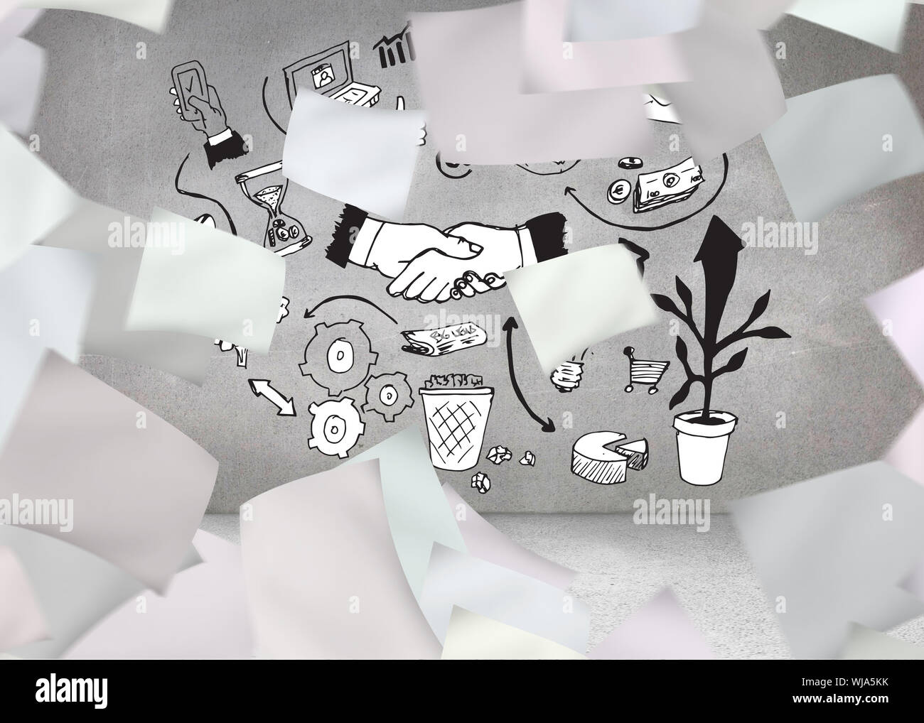 Papers in front of grey wall with graphics Stock Photo - Alamy