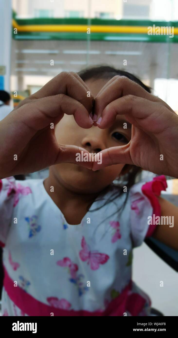 Girl making heart hands hi-res stock photography and images - Alamy