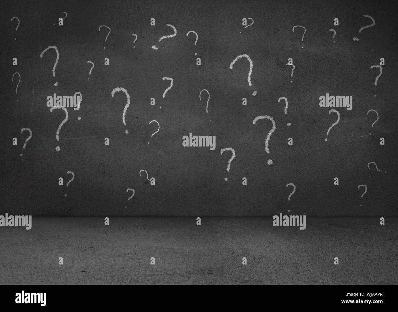 White question marks on grey wall Stock Photo - Alamy
