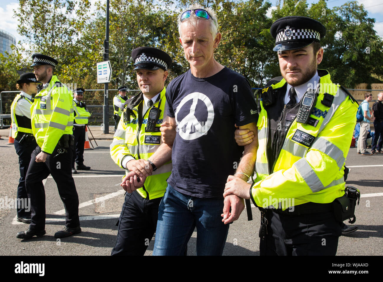 London, UK. 3 September, 2019. Police officers arrest Quakers blocking ...