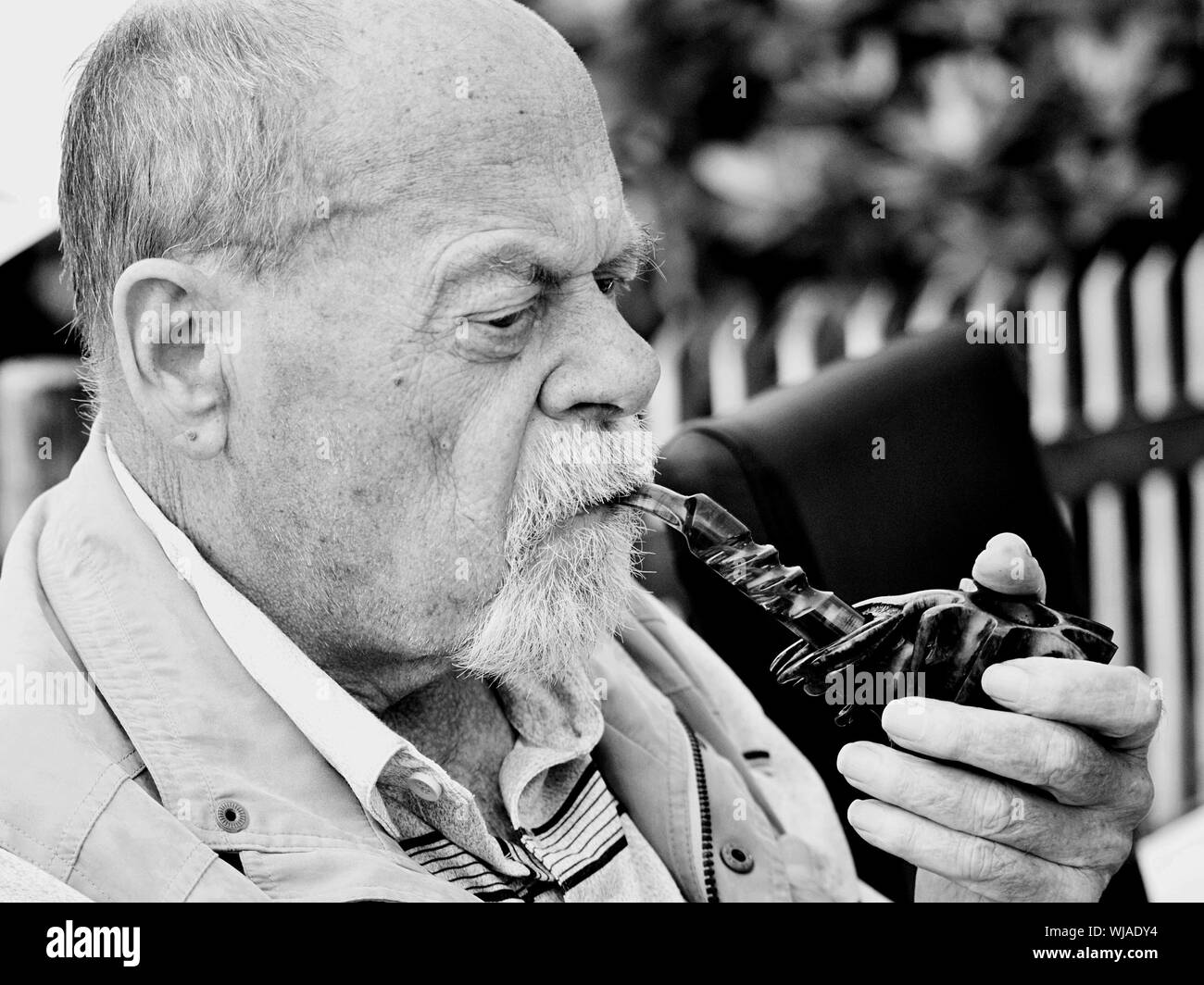 Old man smoking cigarette hi-res stock photography and images - Alamy