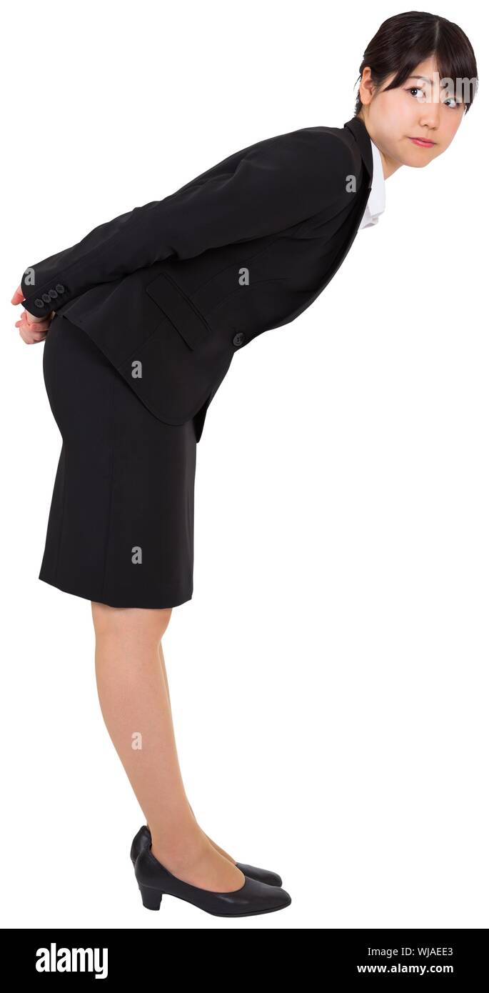 Serious businesswoman bending Stock Photo - Alamy