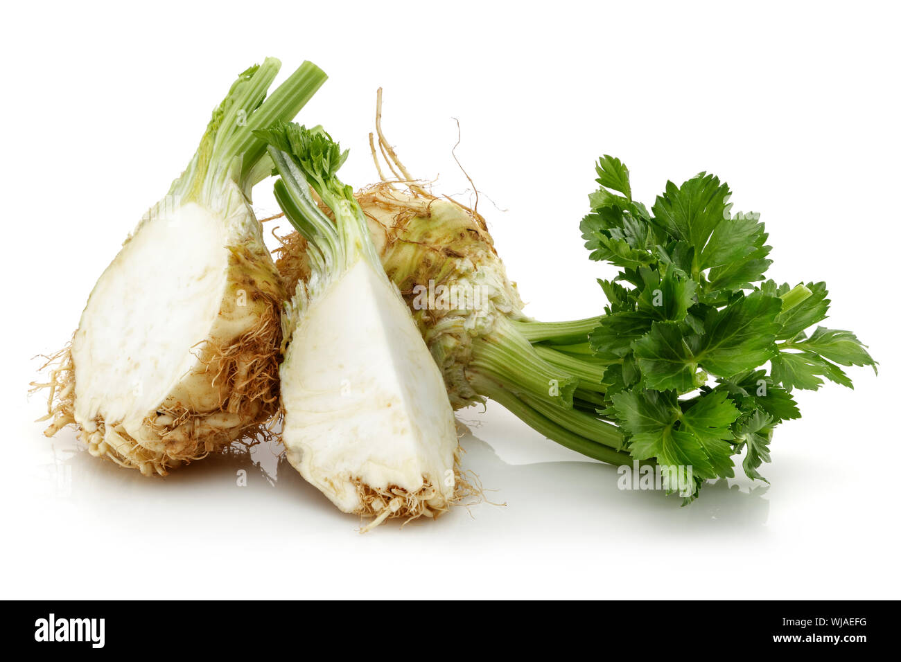 Fresh celeriac root with slice isolated background Stock Photo - Alamy