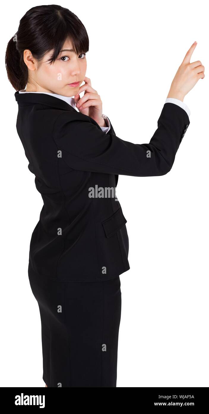 Thoughtful businesswoman pointing Stock Photo - Alamy