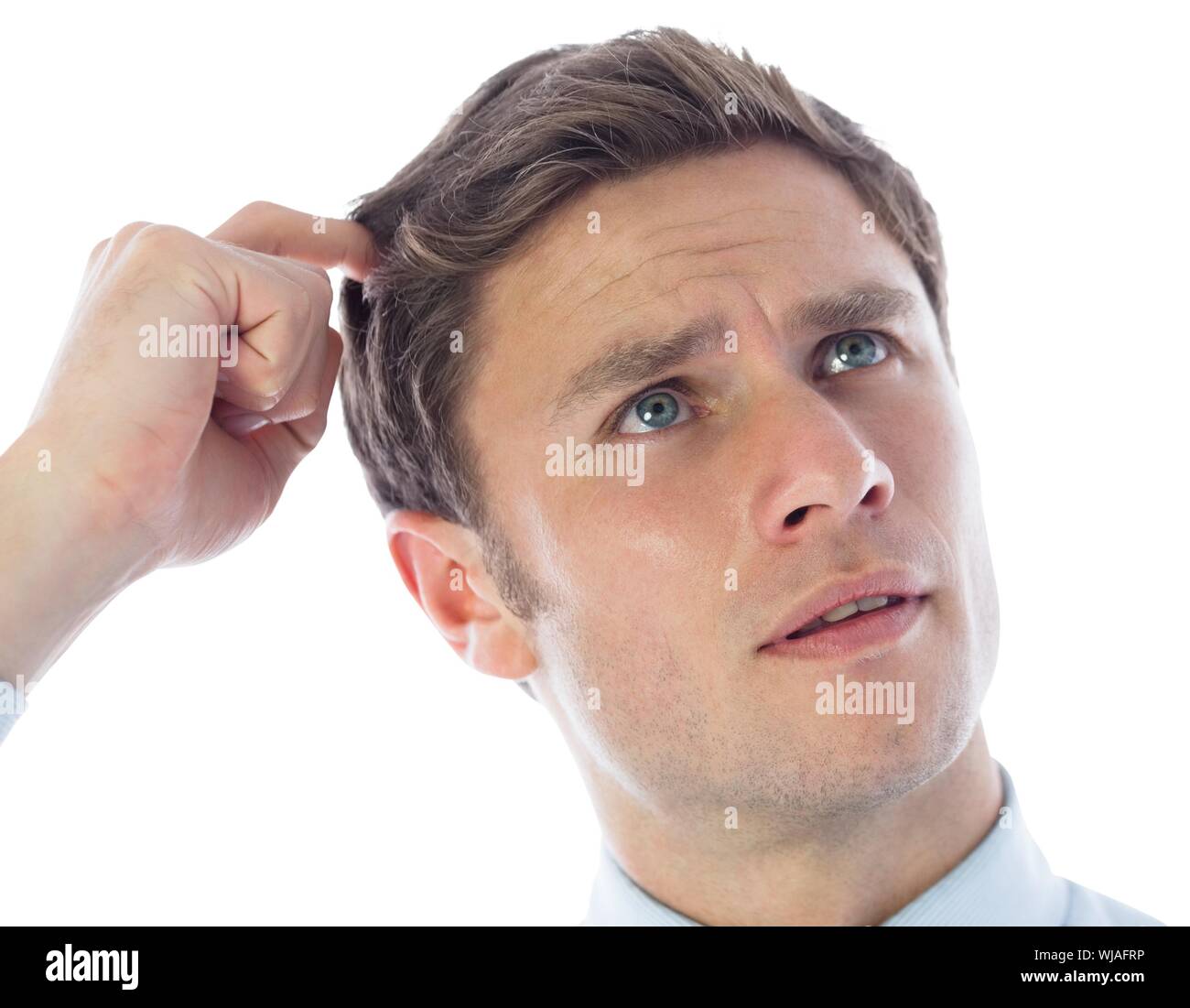 Thinking businessman scratching head Stock Photo - Alamy