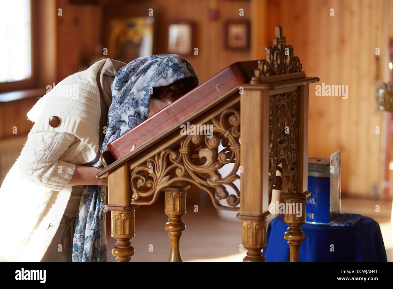 Orthodox woman praying in front of icons in the Church Stock Photo - Alamy