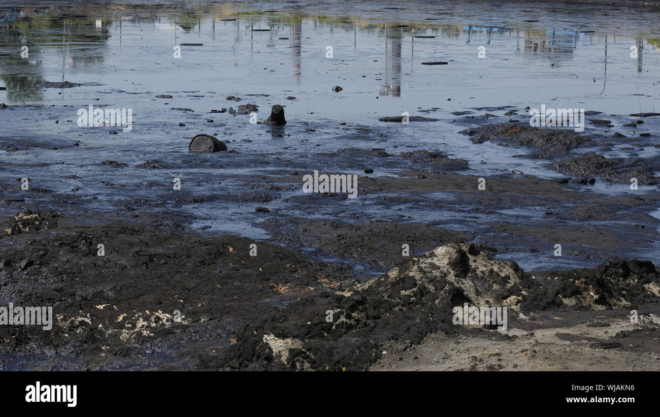 Contamination water and soil spot oil pollutions, former dump toxic ...