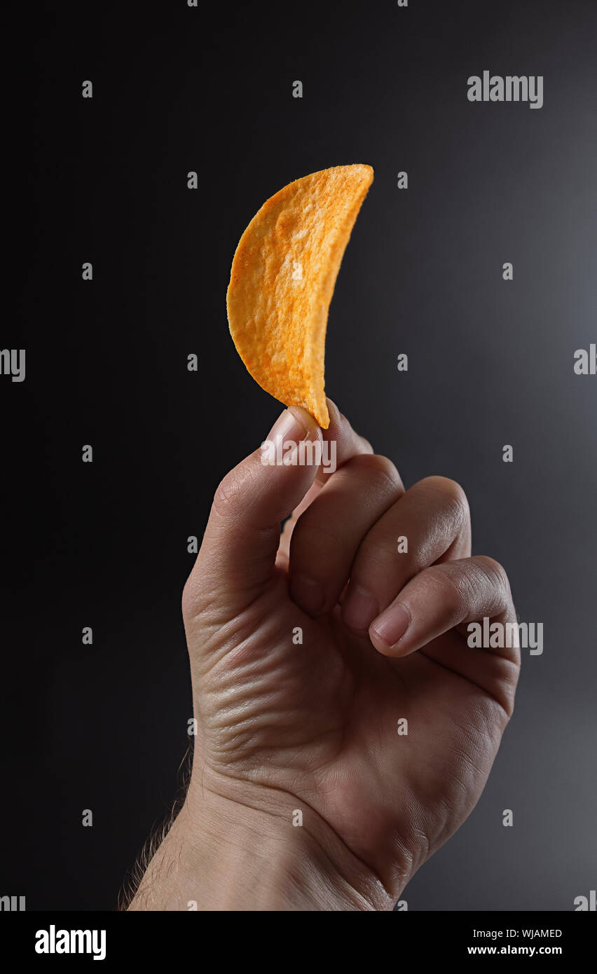 Holding potato chip hi-res stock photography and images - Alamy