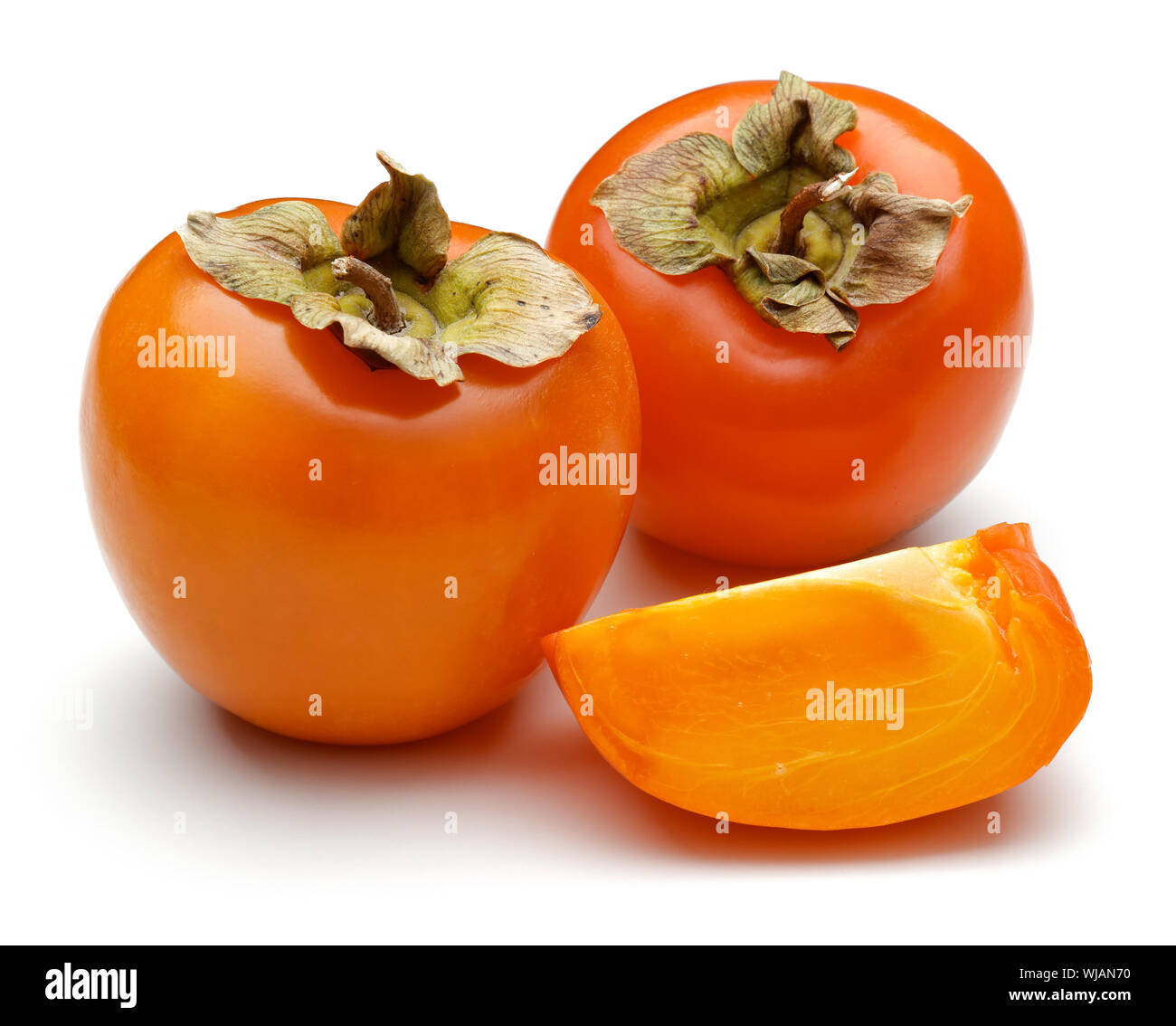 Whole and sliced ripe persimmon fruits isolated on white background ...