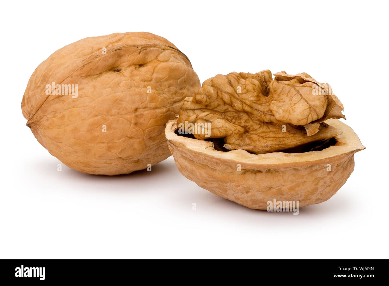 Broken walnut isolated on white background Stock Photo - Alamy