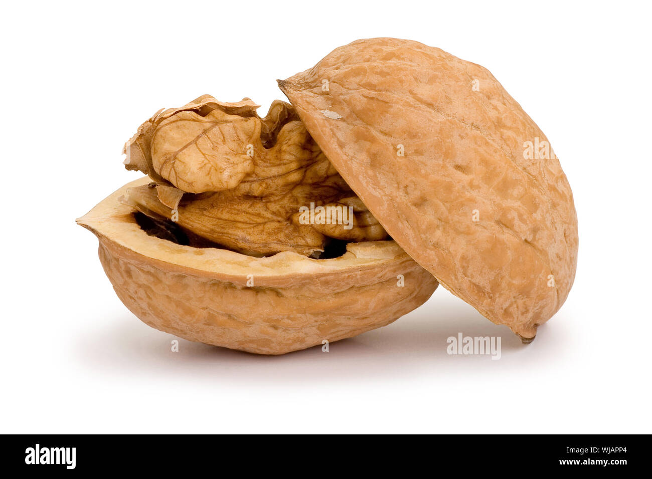 Broken walnut isolated on white background Stock Photo - Alamy
