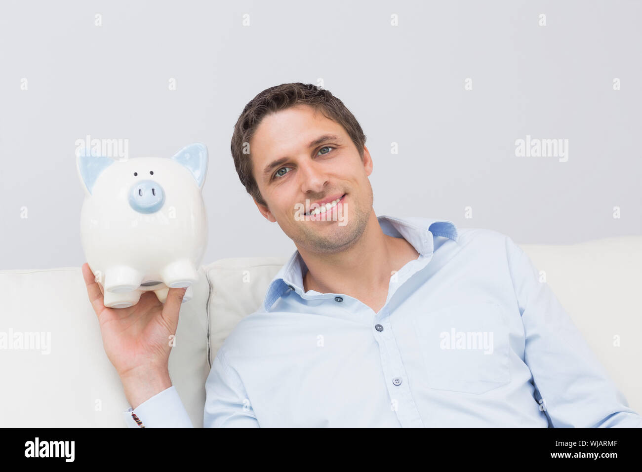 Man piggy bank hi-res stock photography and images - Alamy
