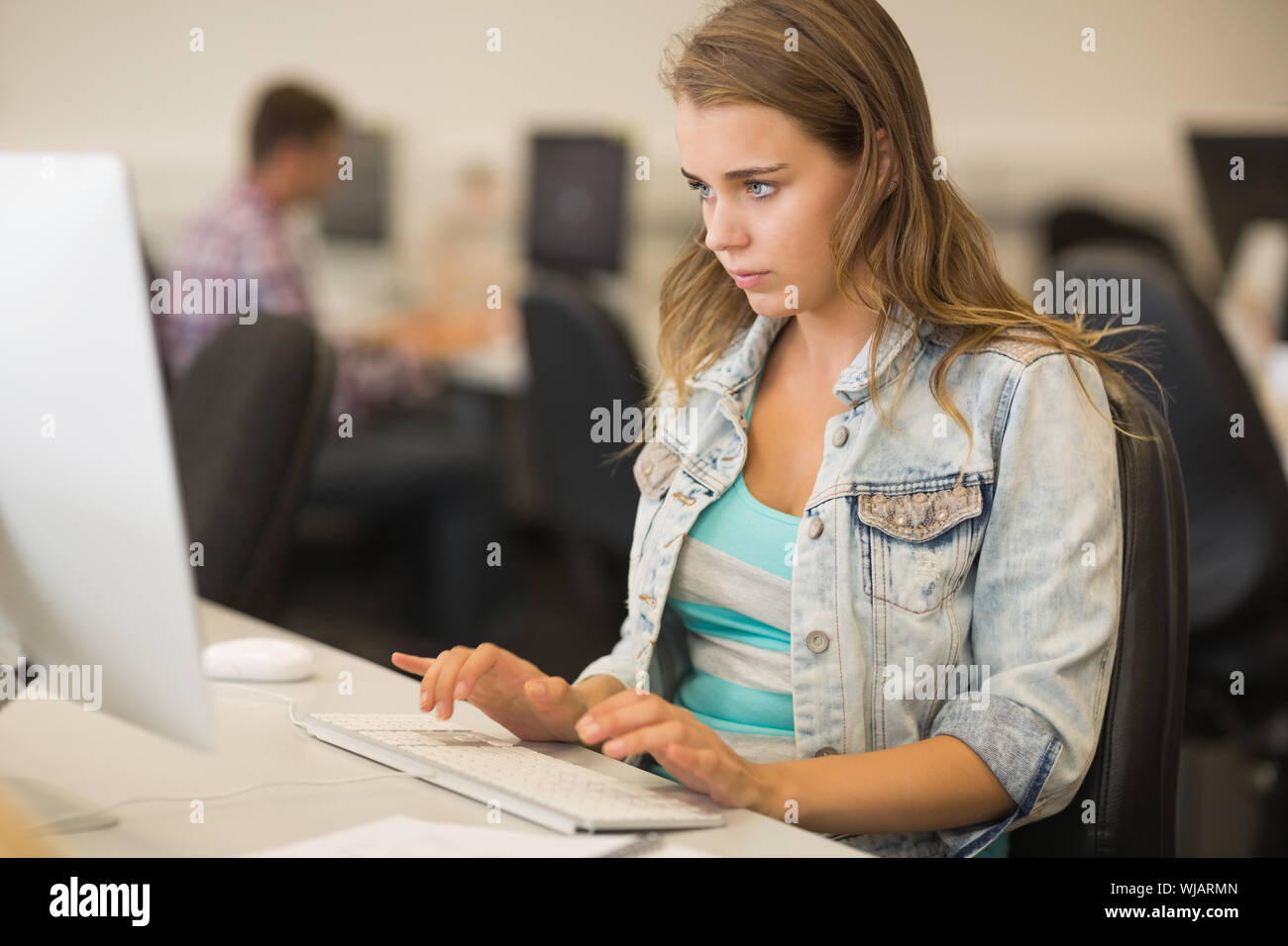 Young adult serious computer hi-res stock photography and images - Alamy