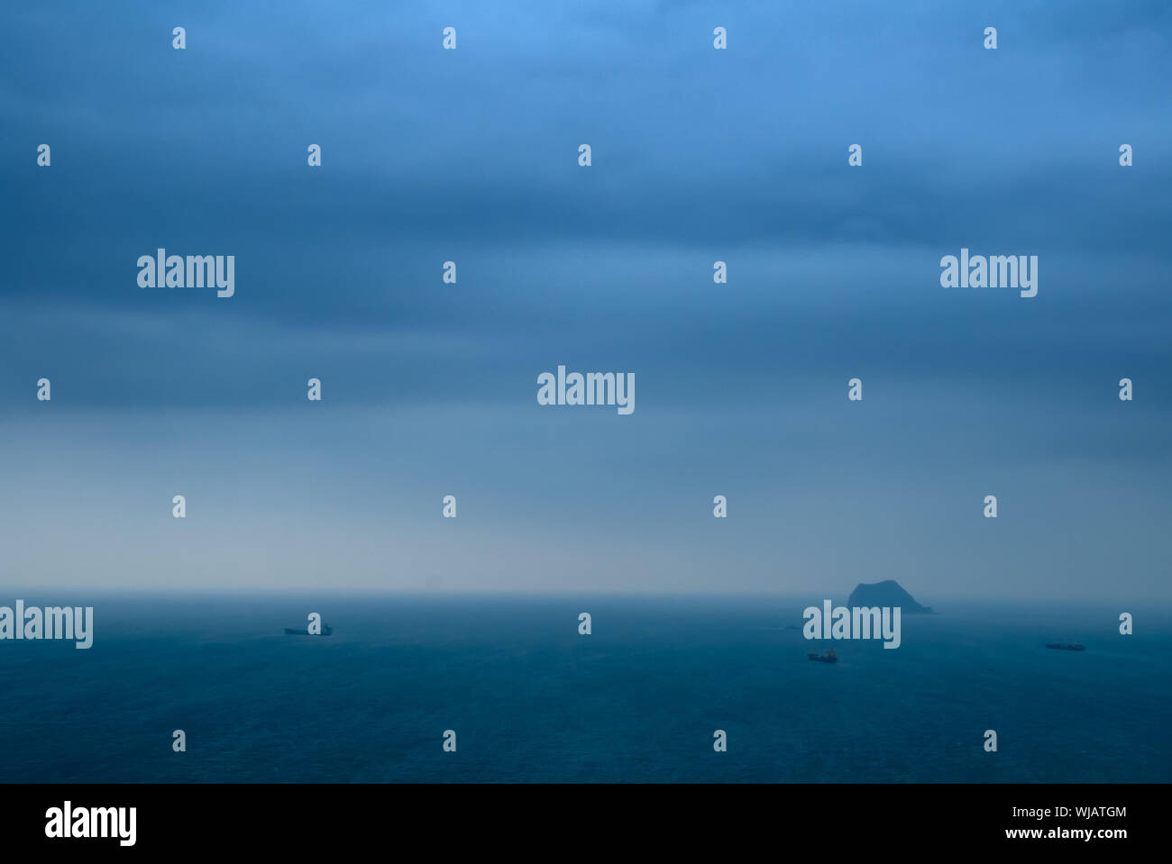 It is the beautiful ocean and small island far away Stock Photo - Alamy