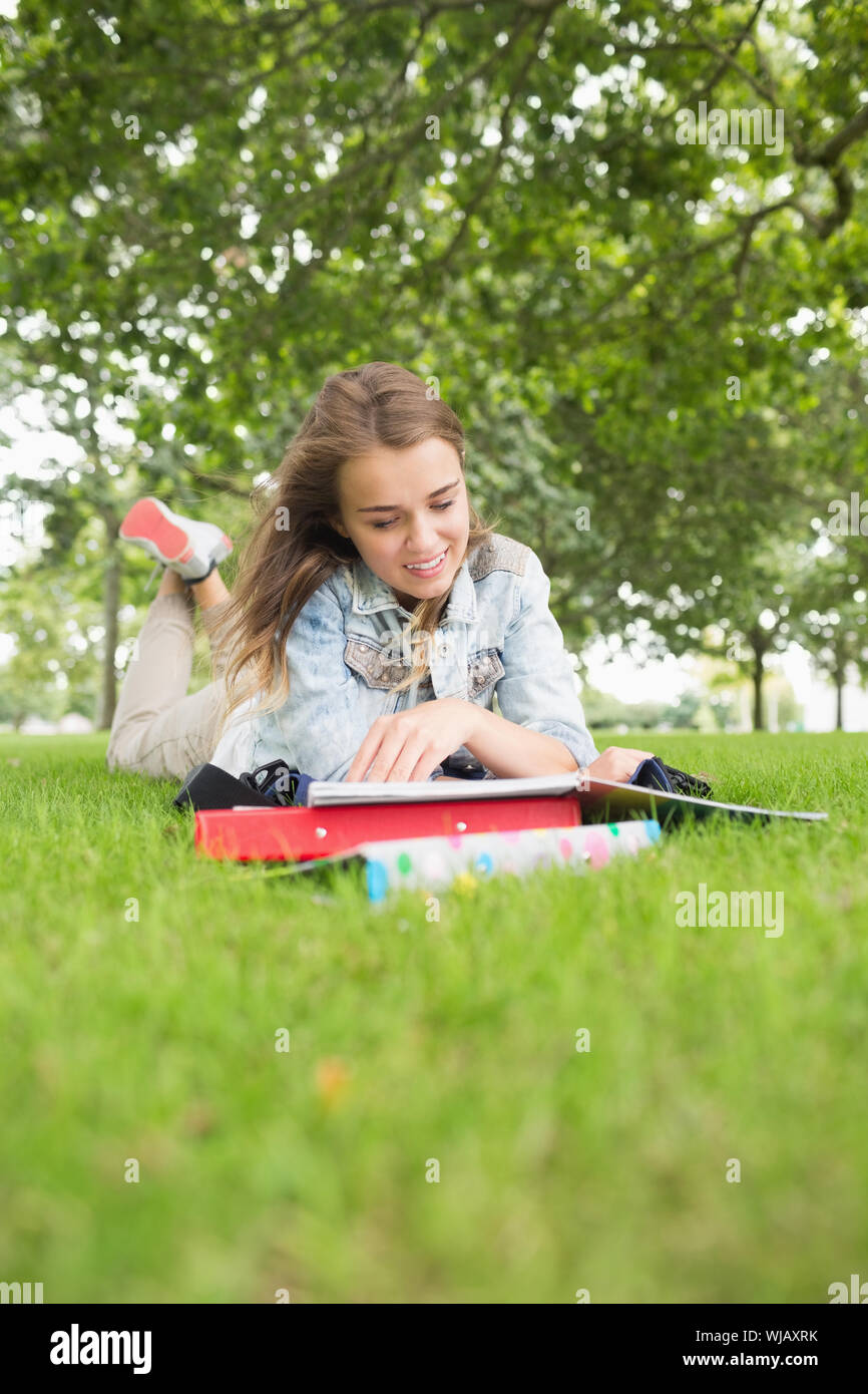 Student books grass hi-res stock photography and images - Alamy