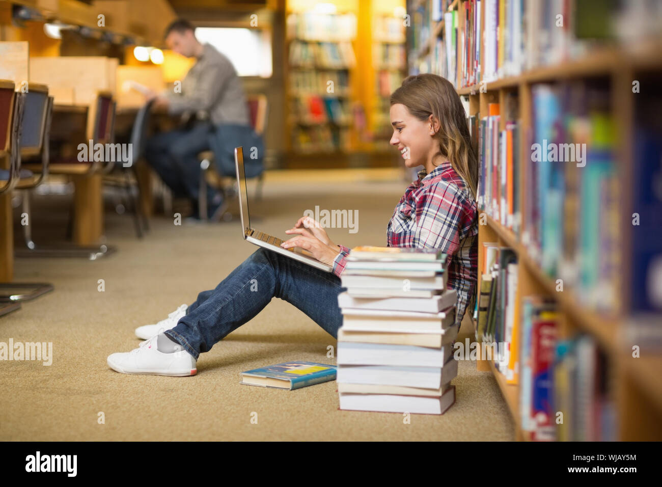Adult student laptop books hi-res stock photography and images - Alamy
