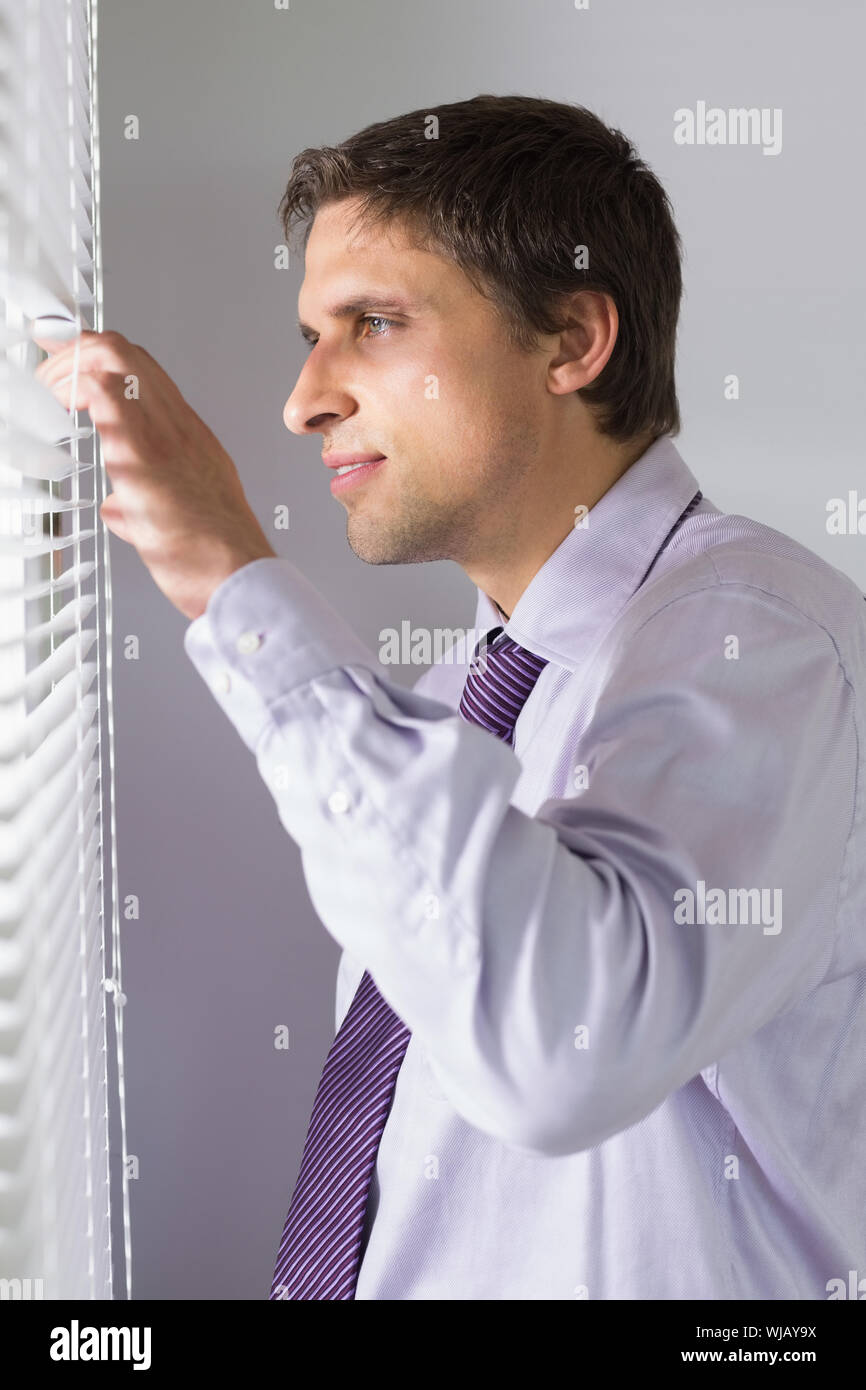 Peeking through blinds hi-res stock photography and images - Alamy