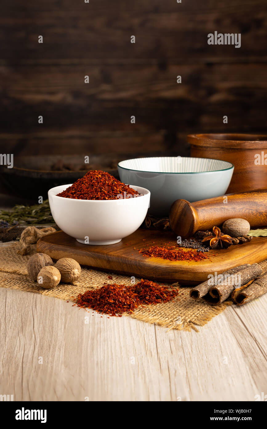 Dry Aleppo Chilli Pepper flakes in a Bowl and with a kitchen setting ...