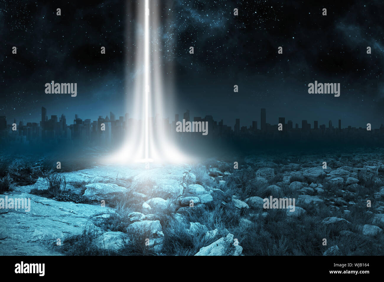 Rocky landscape with light beam Stock Photo - Alamy