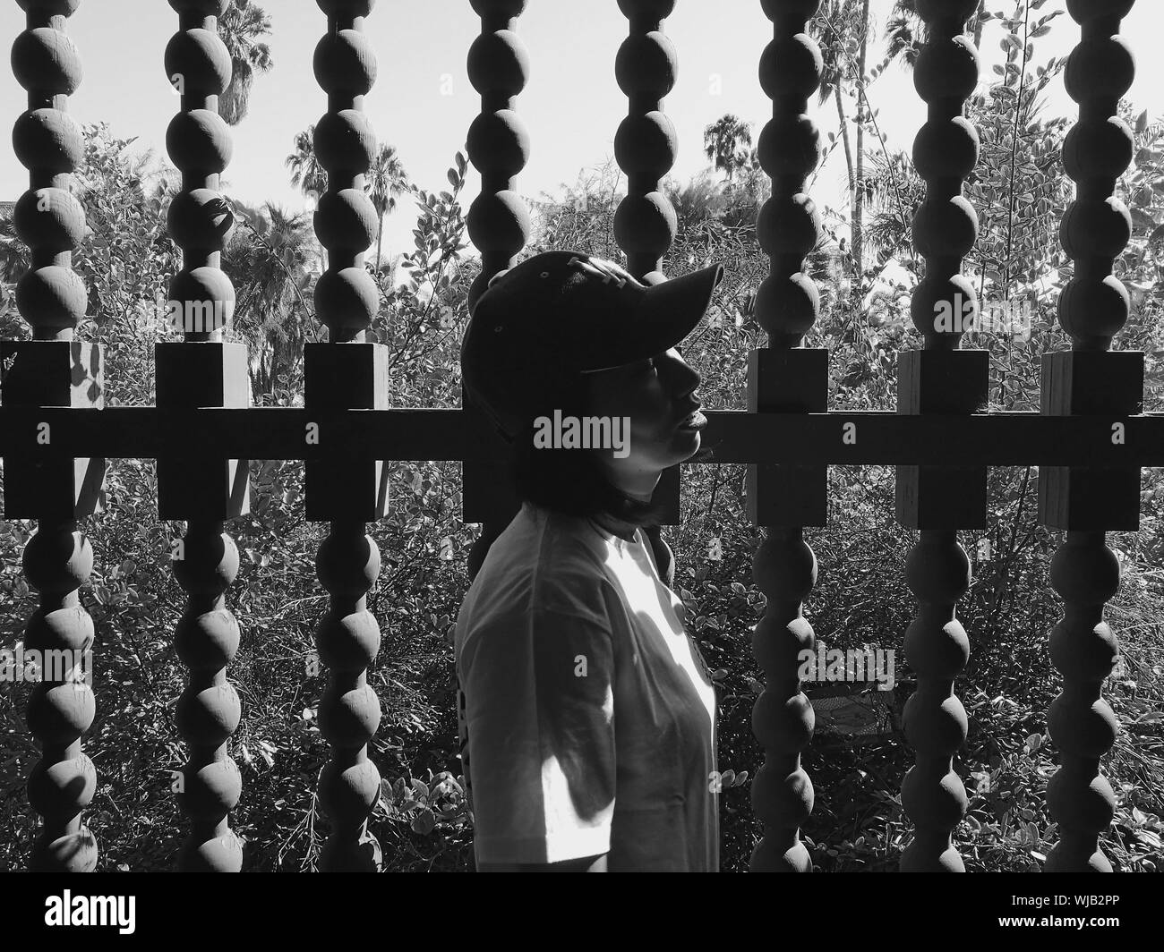 Woman Standing By Gate High Resolution Stock Photography and Images - Alamy