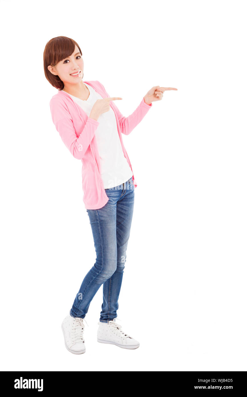 happy young woman finger pointing something Stock Photo - Alamy