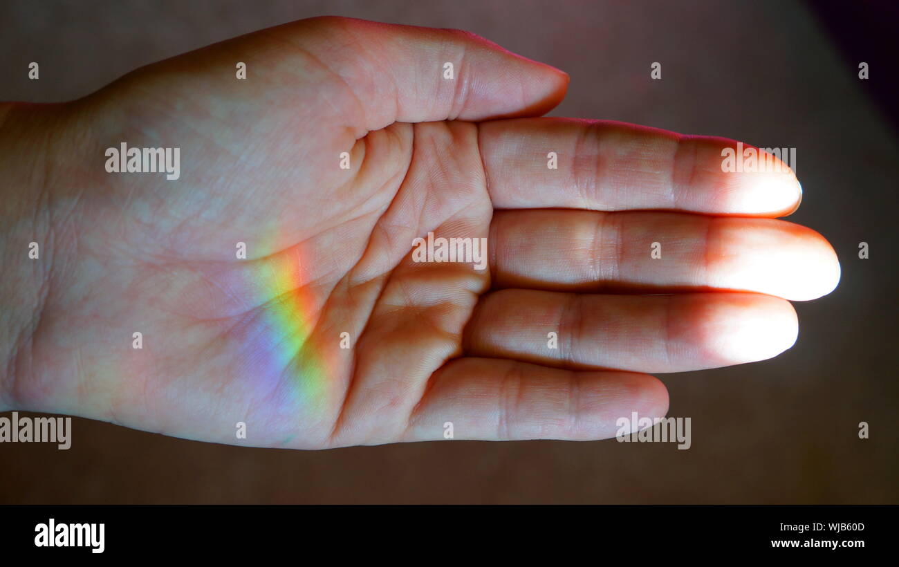 Hand rainbow hi-res stock photography and images - Alamy
