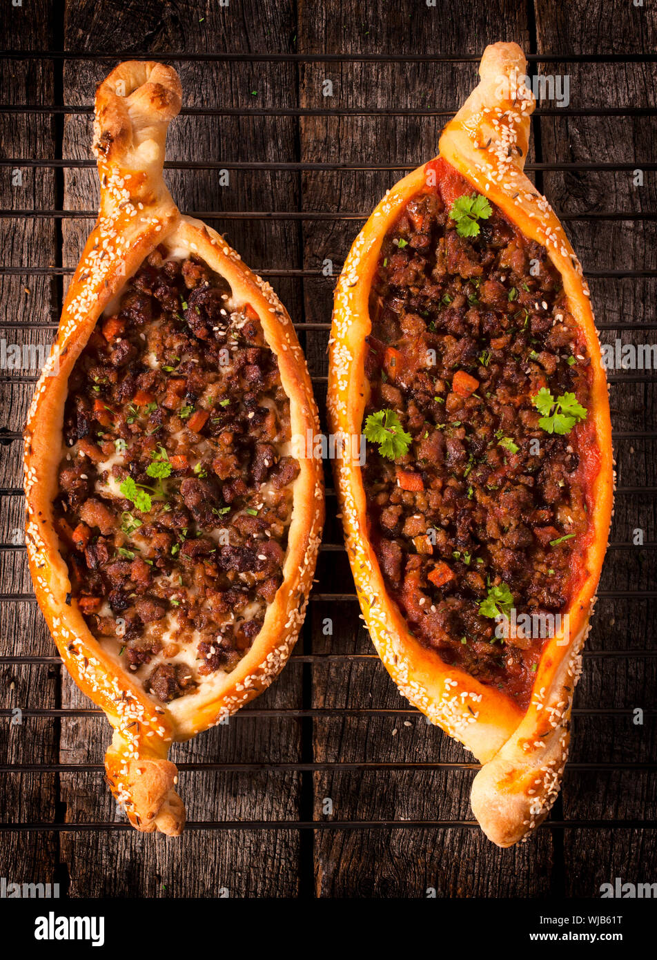 Traditional Turkish pide pastry stuffed with beef meat and sauce from ...
