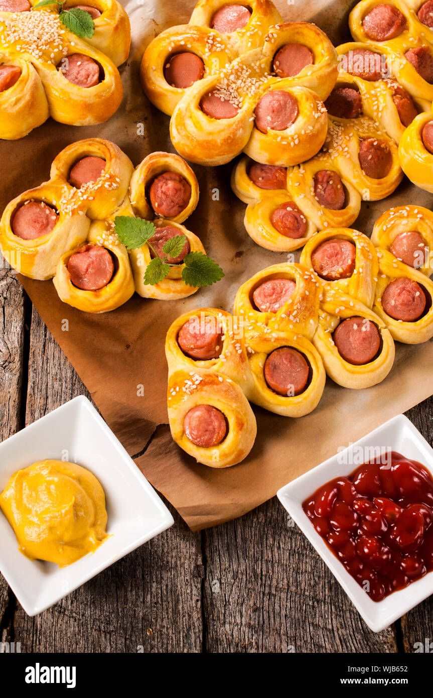 Mini hot dogs in the fresh baked pastry from above Stock Photo - Alamy