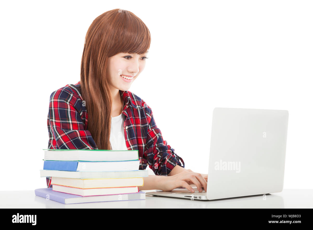 smiling young student girl with book and laptop isolated on white Stock ...