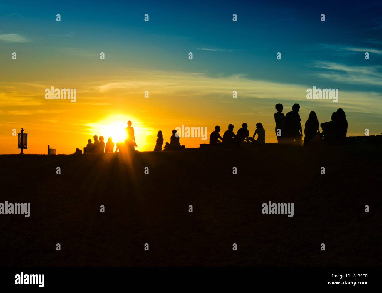 People and sun in back light Stock Photo - Alamy