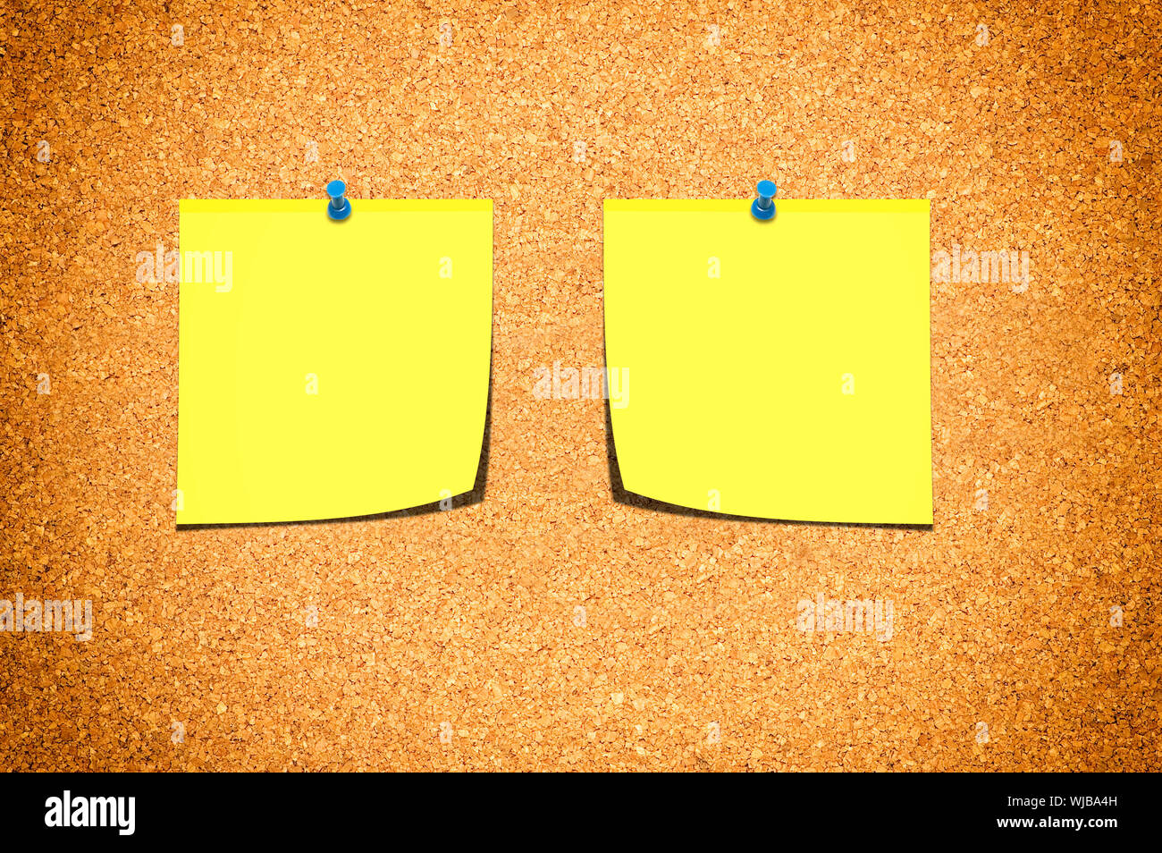 Notes board with two yellow blank papers Stock Photo - Alamy