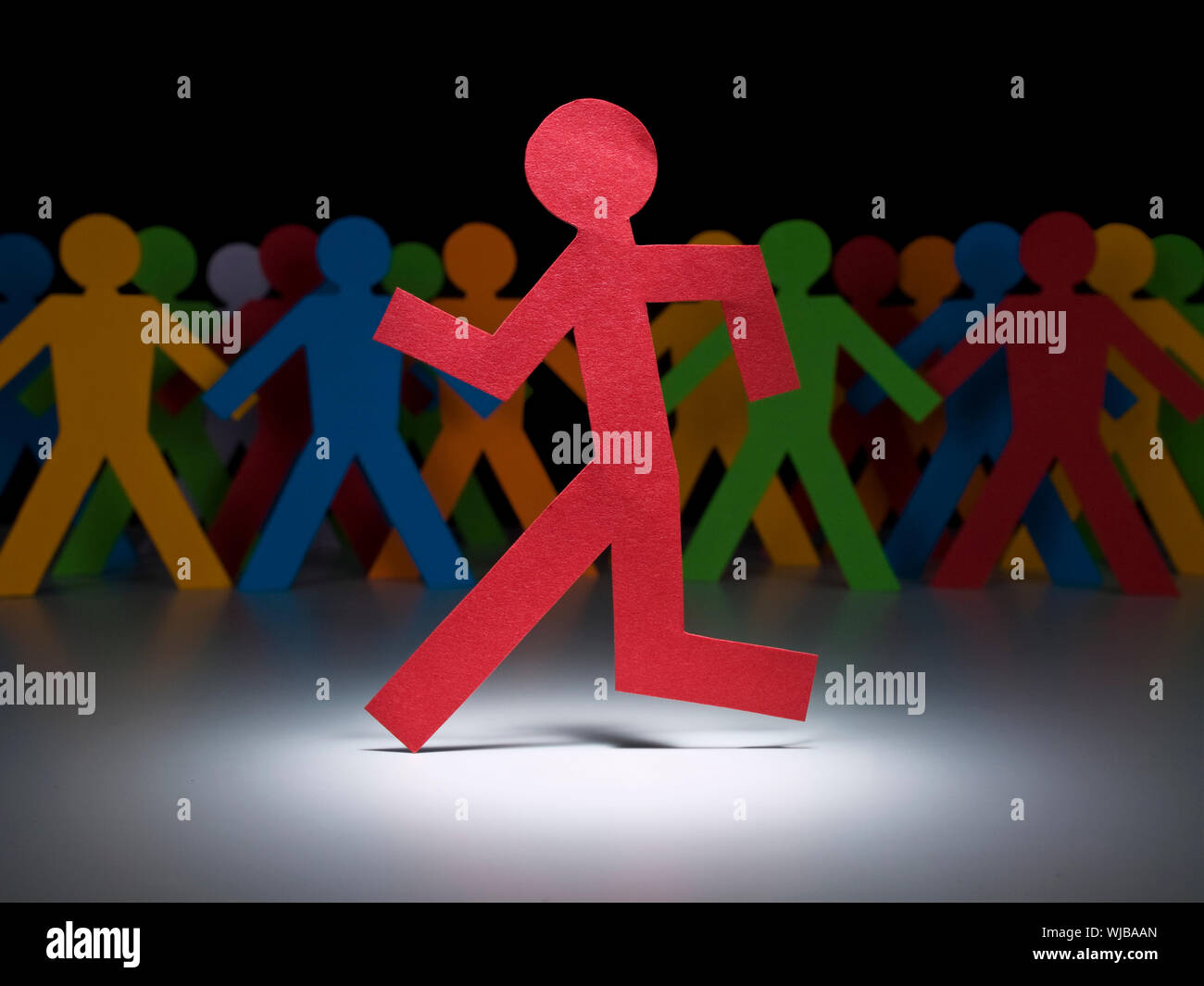 Figure under spotlight hi-res stock photography and images - Alamy
