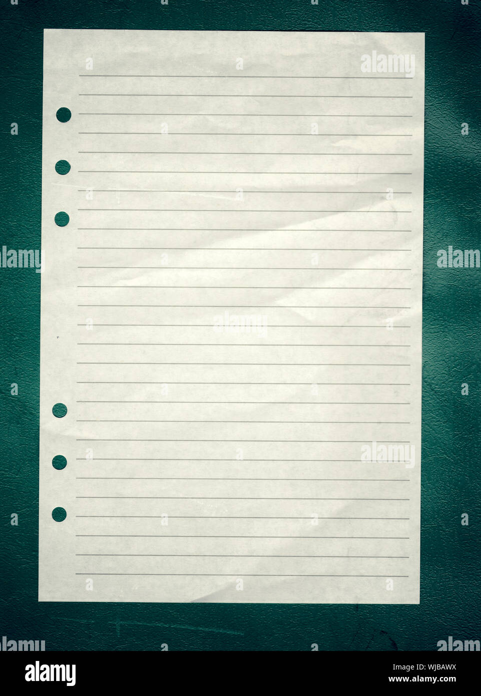 White paper on the green background Stock Photo - Alamy