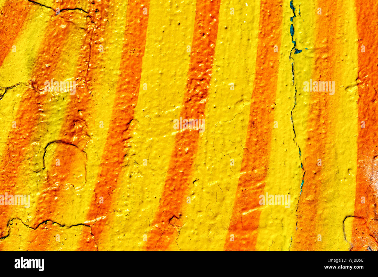 Yellow wall with orange lines background Stock Photo - Alamy