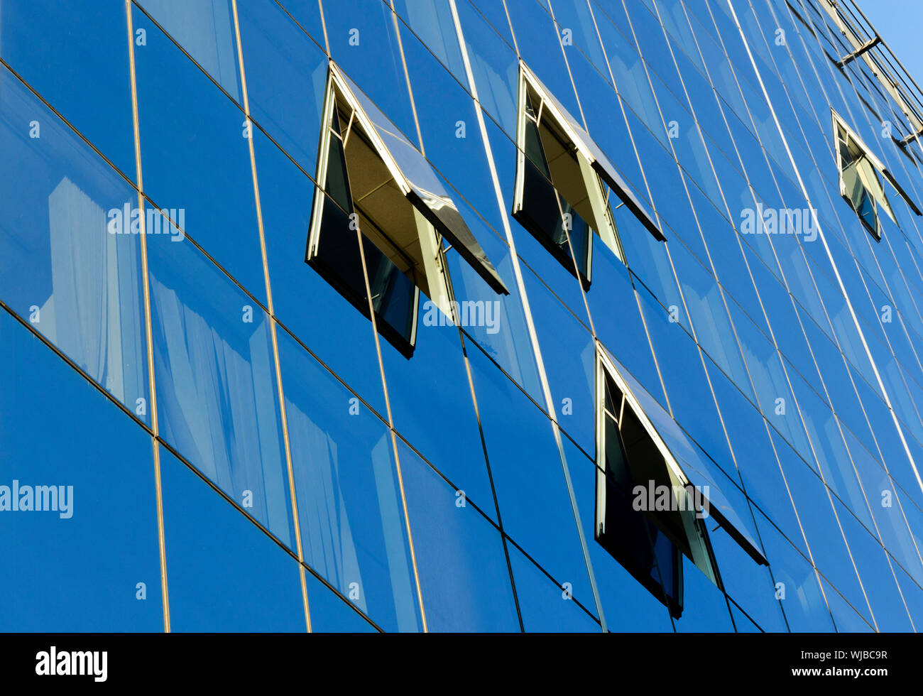 Opened windows on the modern building Stock Photo - Alamy