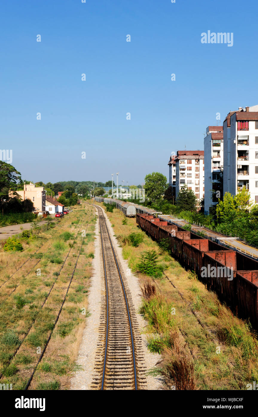 Urban railroad close to state block Stock Photo - Alamy
