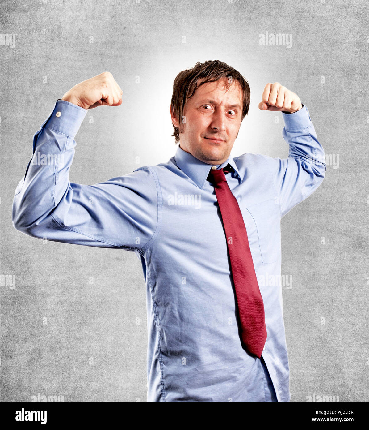 A powerful businessman showing his strength Stock Photo - Alamy