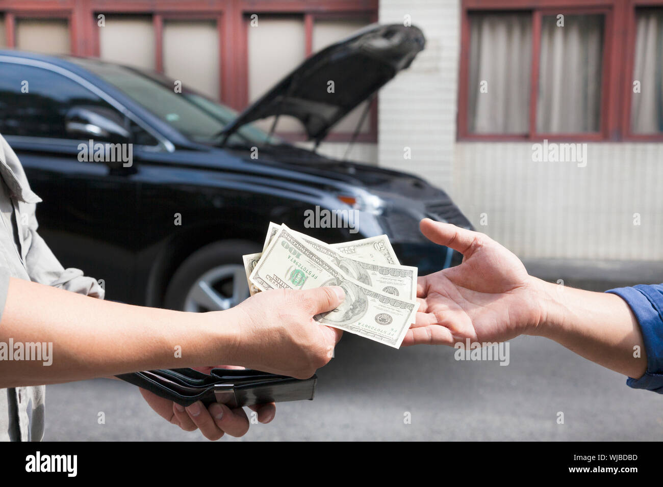 Hand giving cash hand car hi-res stock photography and images - Alamy