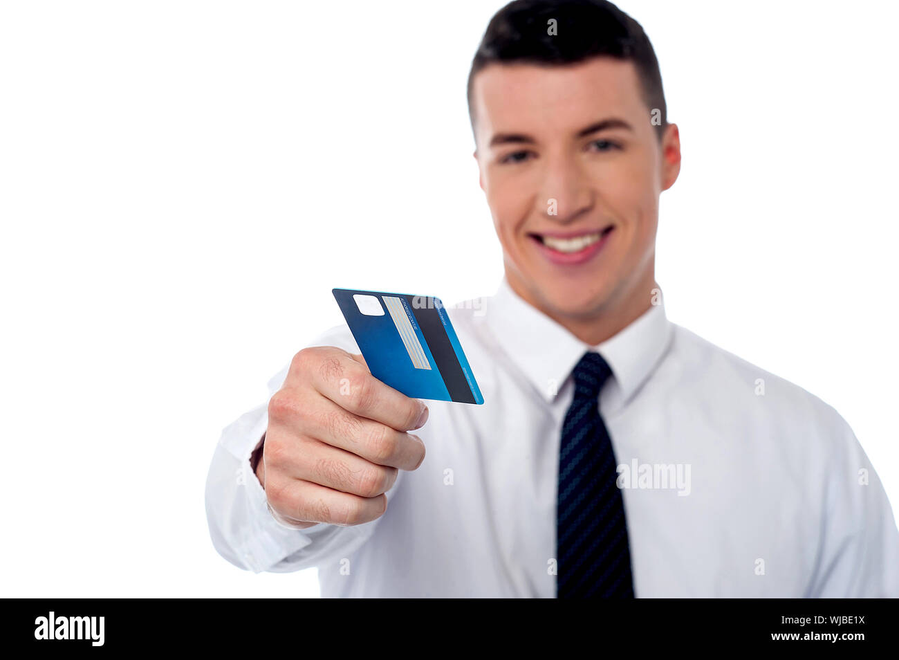 Young corporate guy showing his debit card Stock Photo - Alamy