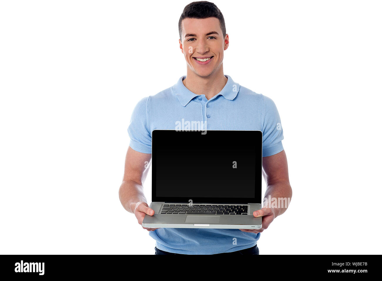 Handsome young man showing his new laptop Stock Photo - Alamy