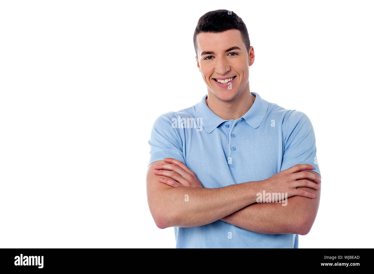 Smiling man posing with confidence Stock Photo - Alamy