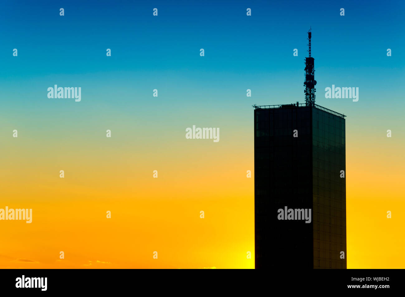 Modern building on the sunset Stock Photo - Alamy