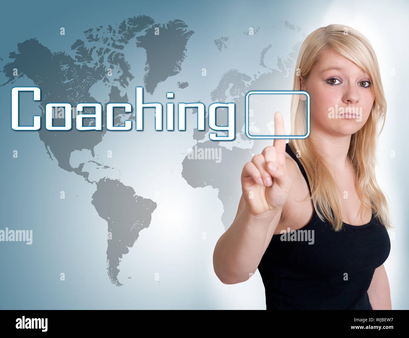 Young woman press digital Coaching button on interface in front of her ...