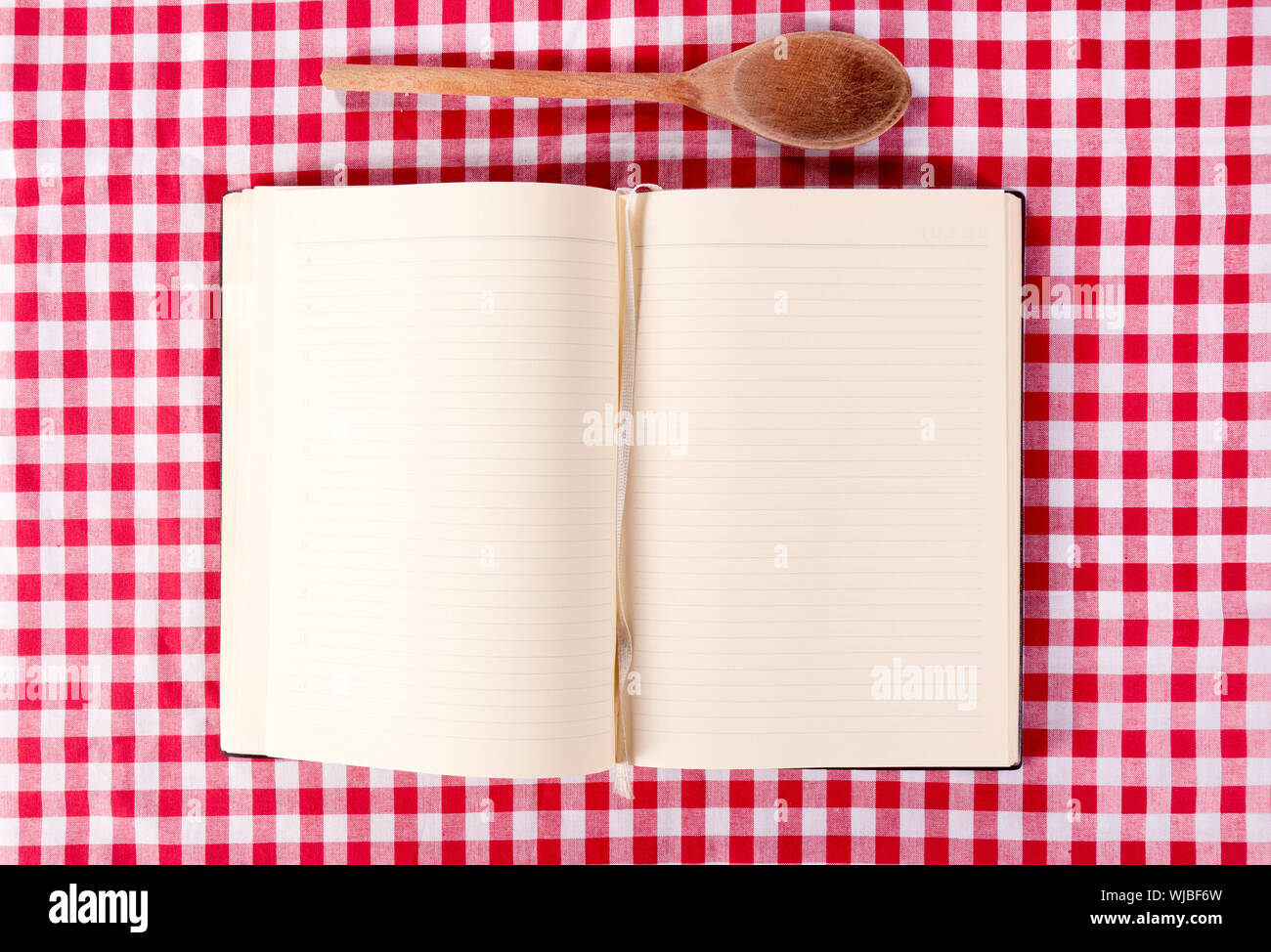 Blank cooking book and wooden ladle from above Stock Photo - Alamy