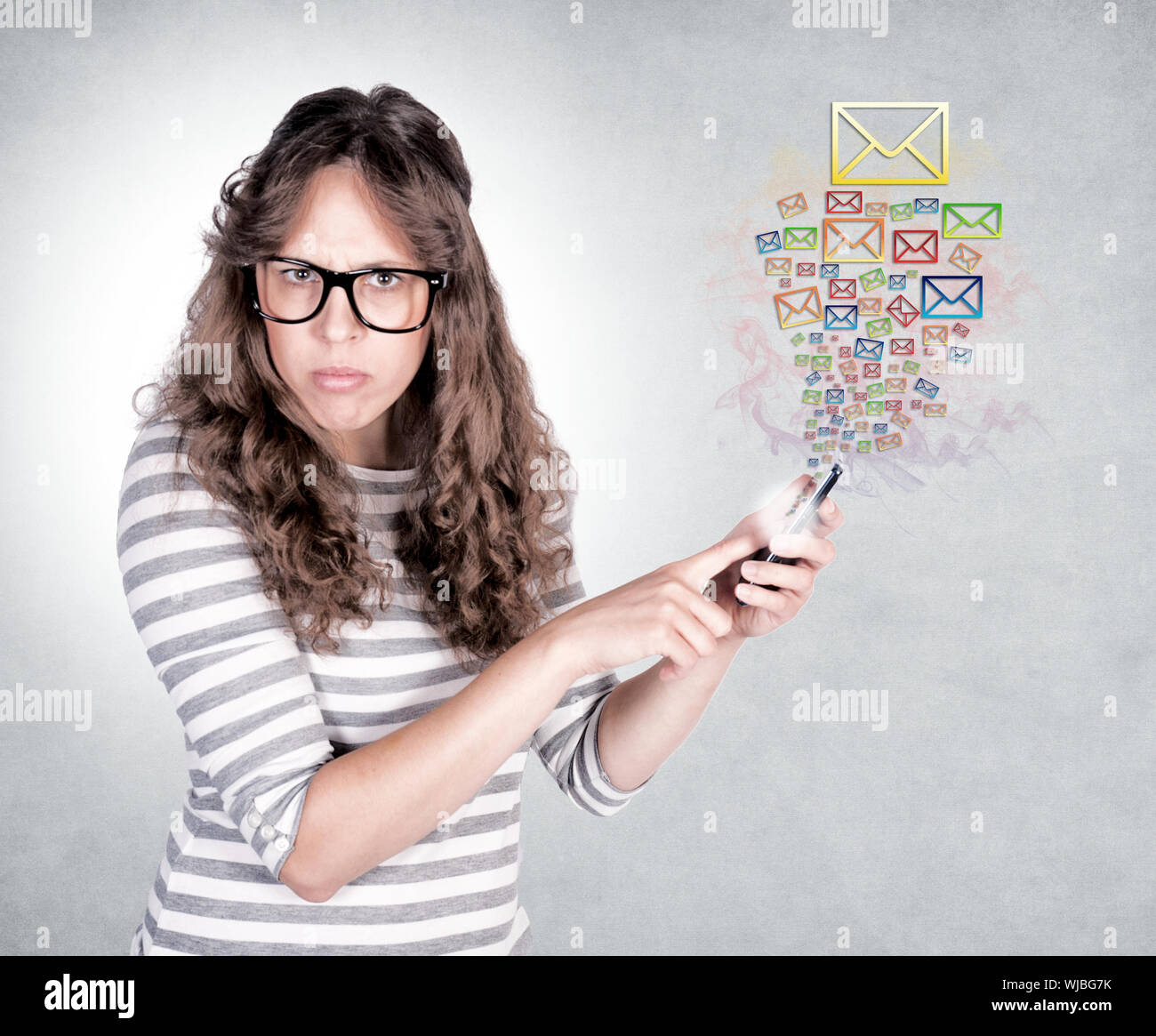 Female sending text message via mobile phone Stock Photo - Alamy