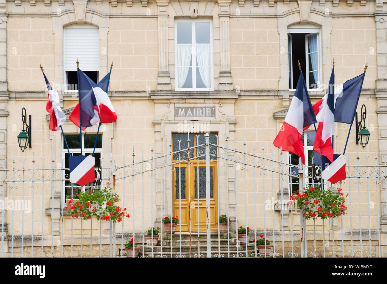 Typical French town hall with flags Stock Photo - Alamy