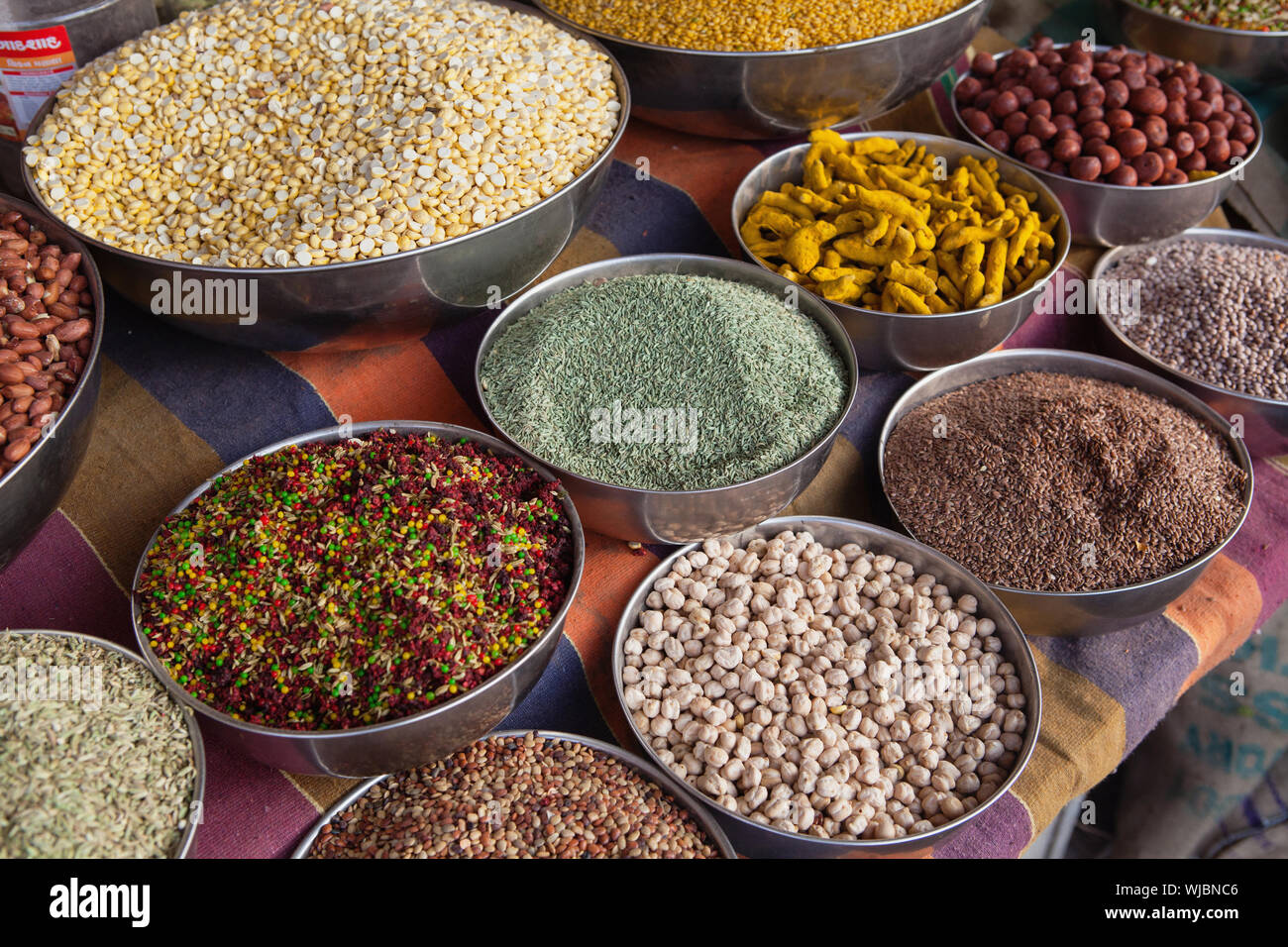 India, Karnataka, Bijapur, Display of lentils, spices and pulses in the ...