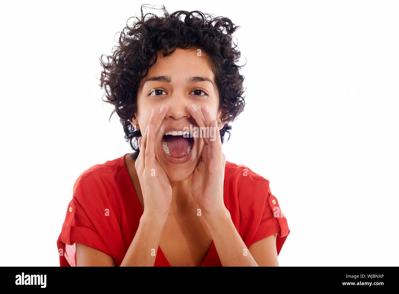 Portrait of happy hispanic woman screaming and shouting at camera Stock ...
