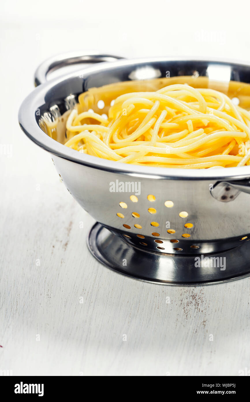 Golden colander hi-res stock photography and images - Alamy